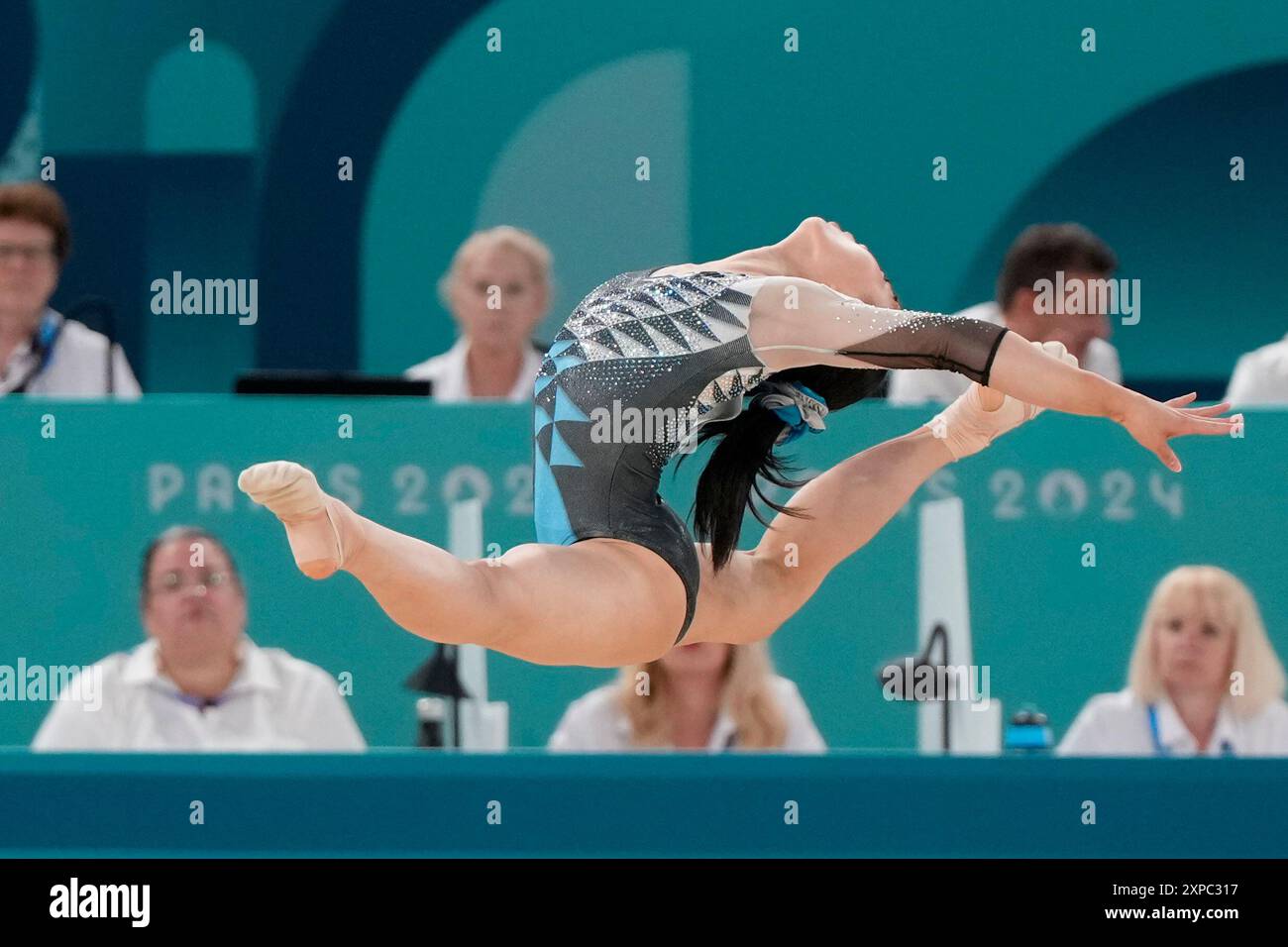 Rina Kishi, of Japan, competes during the women's artistic gymnastics ...
