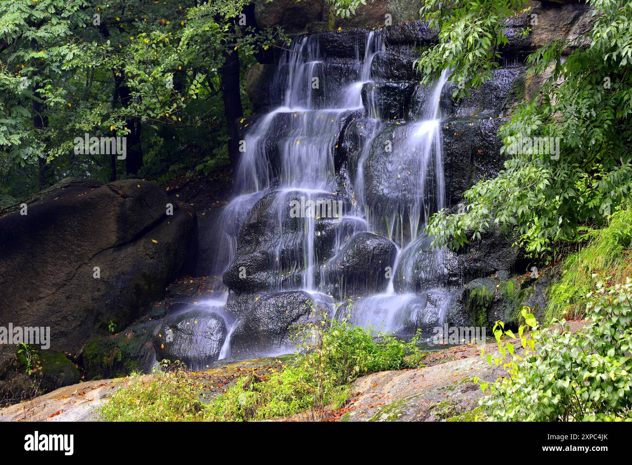A picturesque waterfall in the Sophia Park in autumn, Uman, Ukraine ...