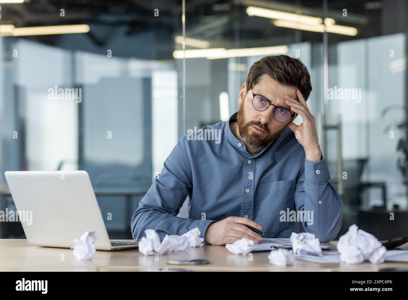Businessman sitting desk crumpled hi-res stock photography and images ...