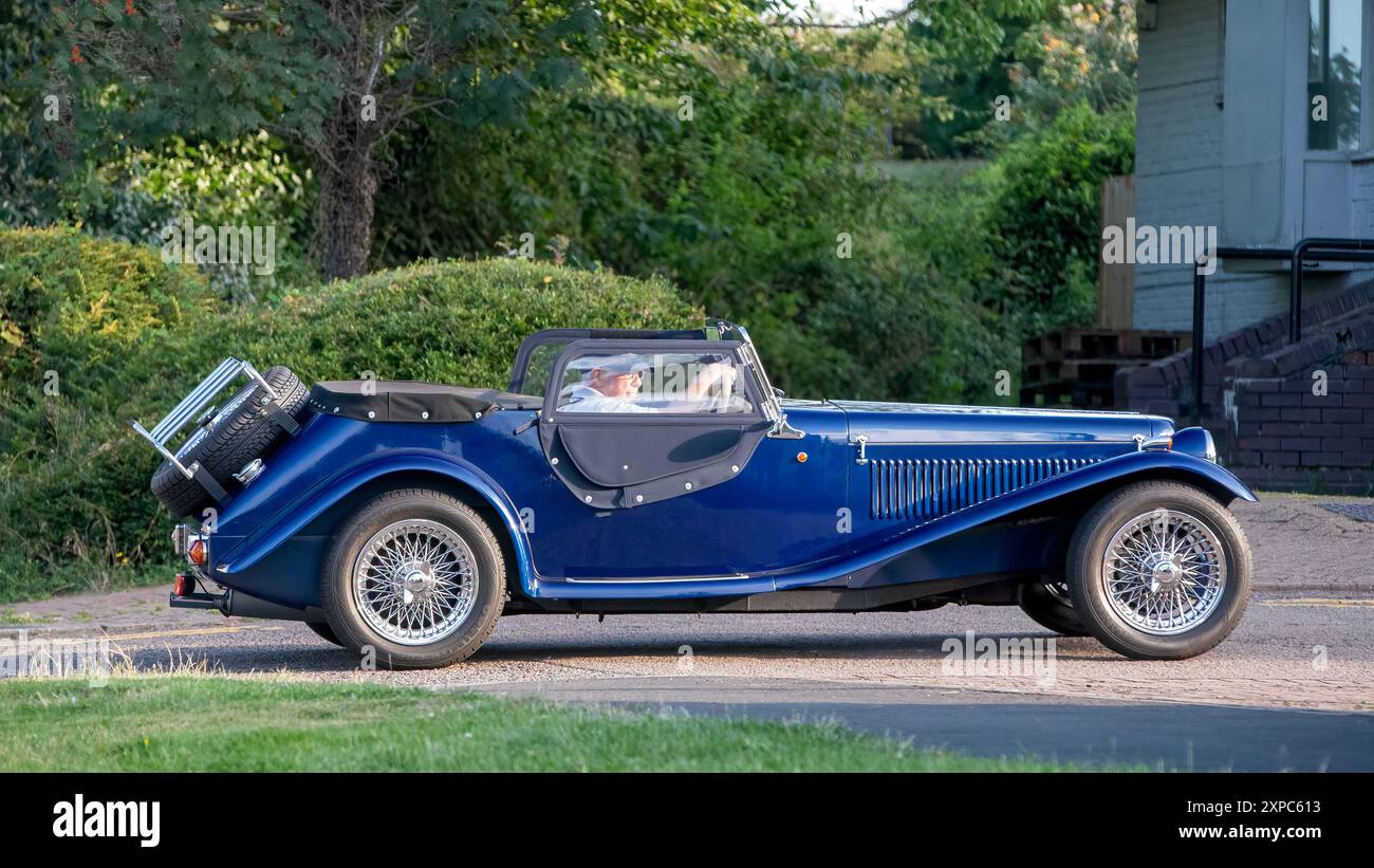 Milton Keynes,UK - August 3rd 2024: 2006 blue NG TF kit car driving on ...