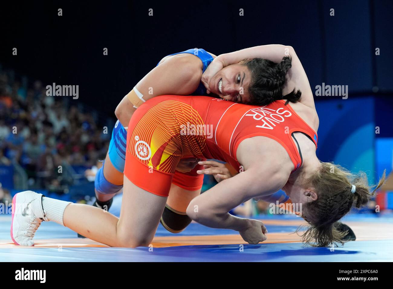Ukraine's Tetiana Sova Rizhko and India's Nisha Nisha compete in the ...