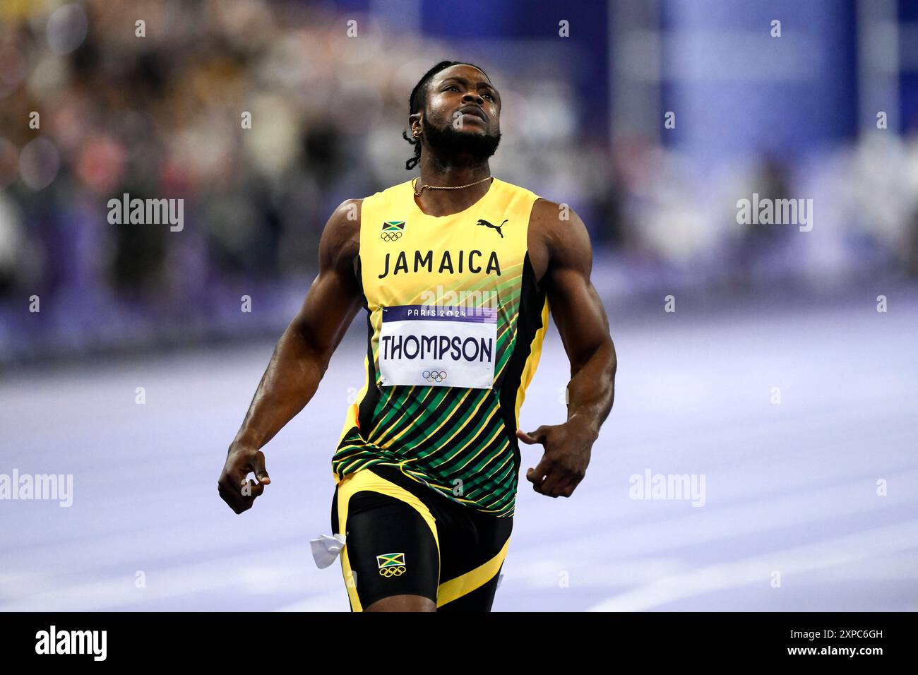 Kishane Thompson of Jamaica reacts after competing in the 100 meters ...