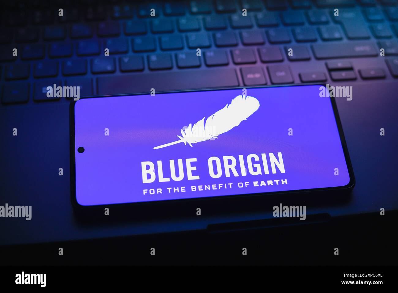 In this photo illustration, the Blue Origin logo is displayed on a ...