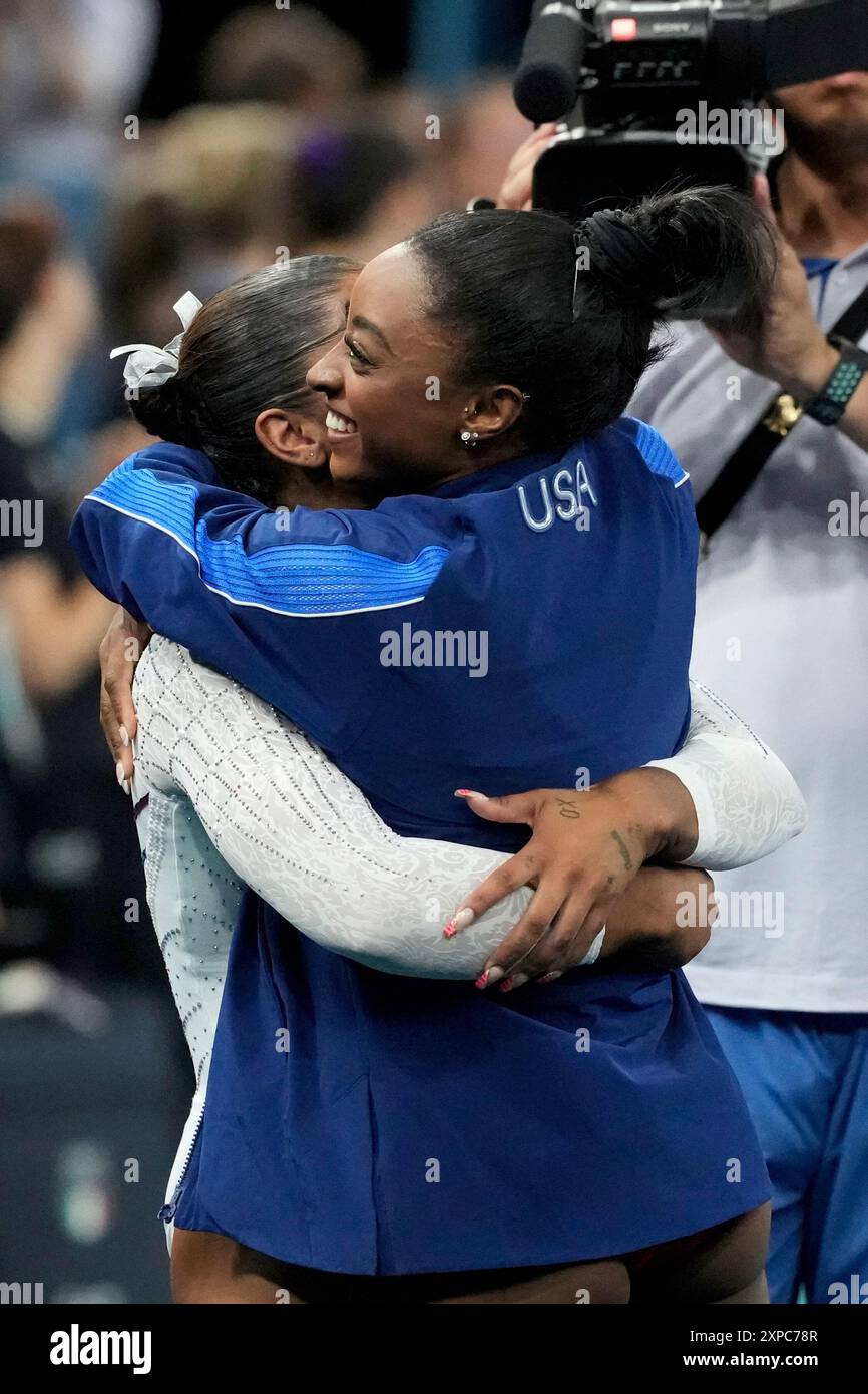 Jordan Chiles, left, of the United States, hugs teammate Simone Biles ...