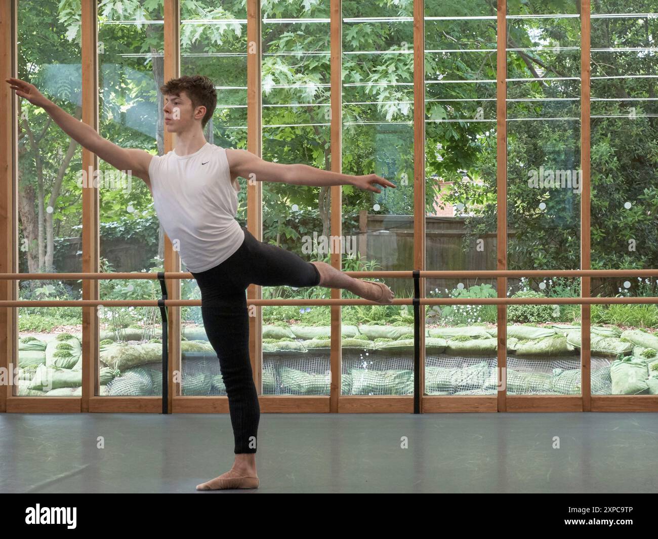 Practising dance in front of fenestration. Rambert School of Ballet ...