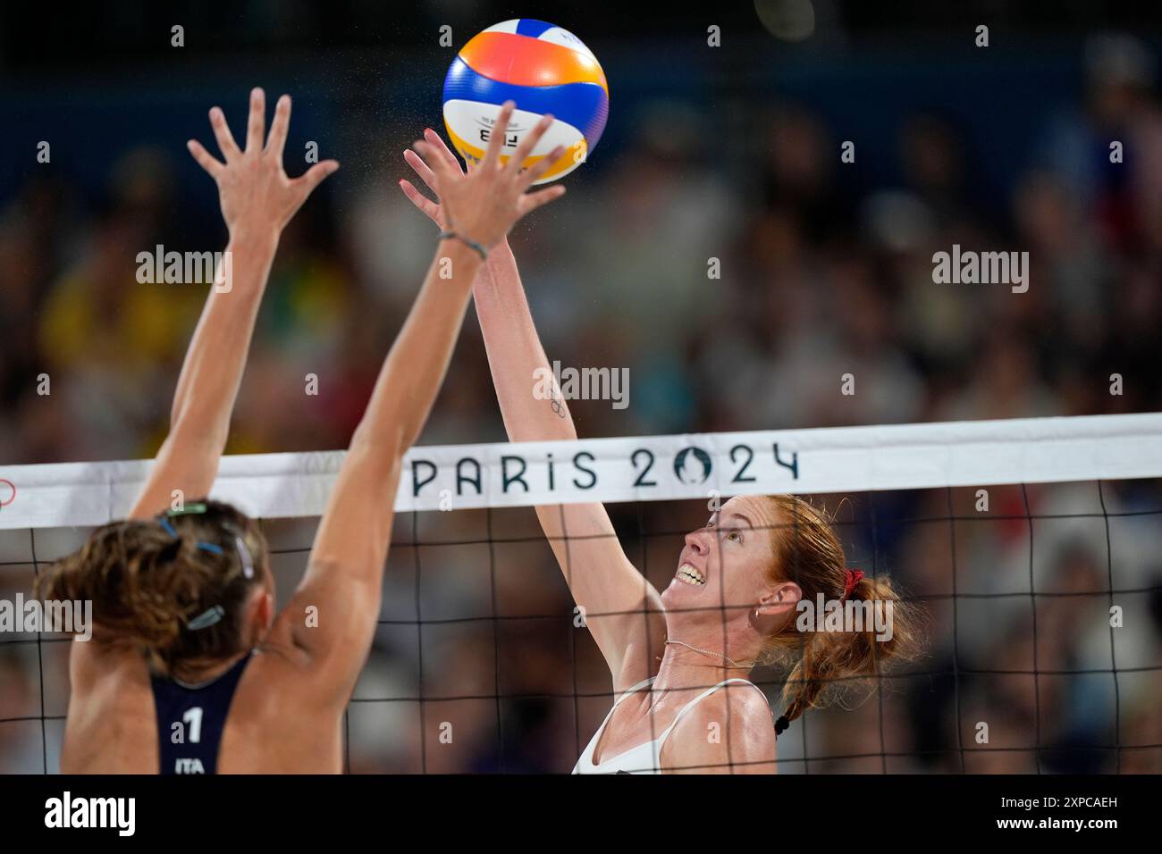 United States' Kelly Cheng hits against Italy in a beach volleyball ...