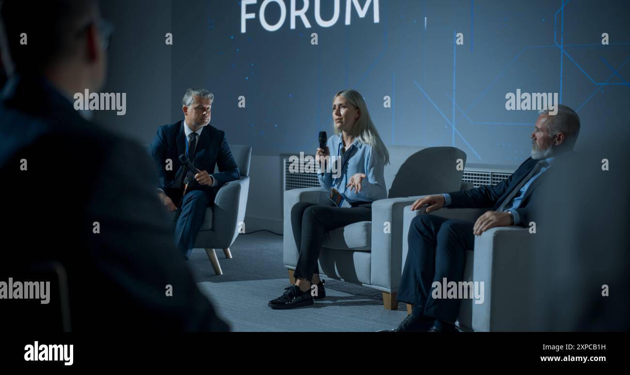 Conference attendees listening panel hi-res stock photography and ...