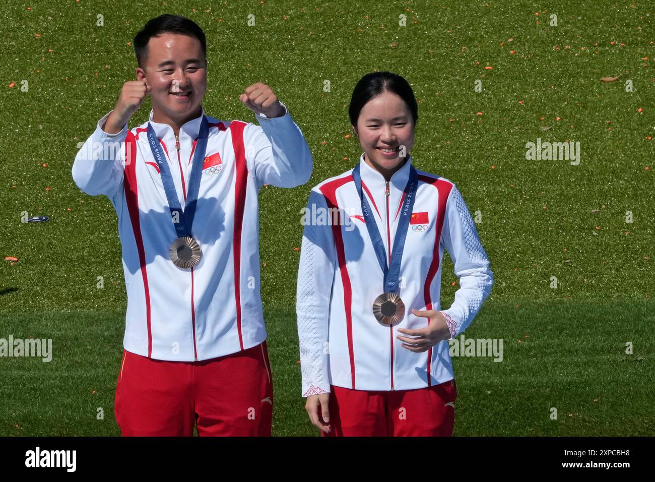 China's Jiang Yiting, right, and teammate Lyu Jianlin pose for a ...