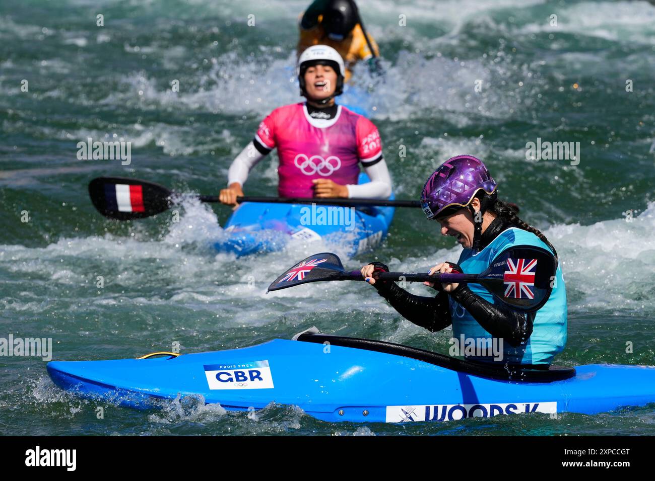 Kimberley Woods of Britain reacts in the finish area of the women's kayak cross finals during ...