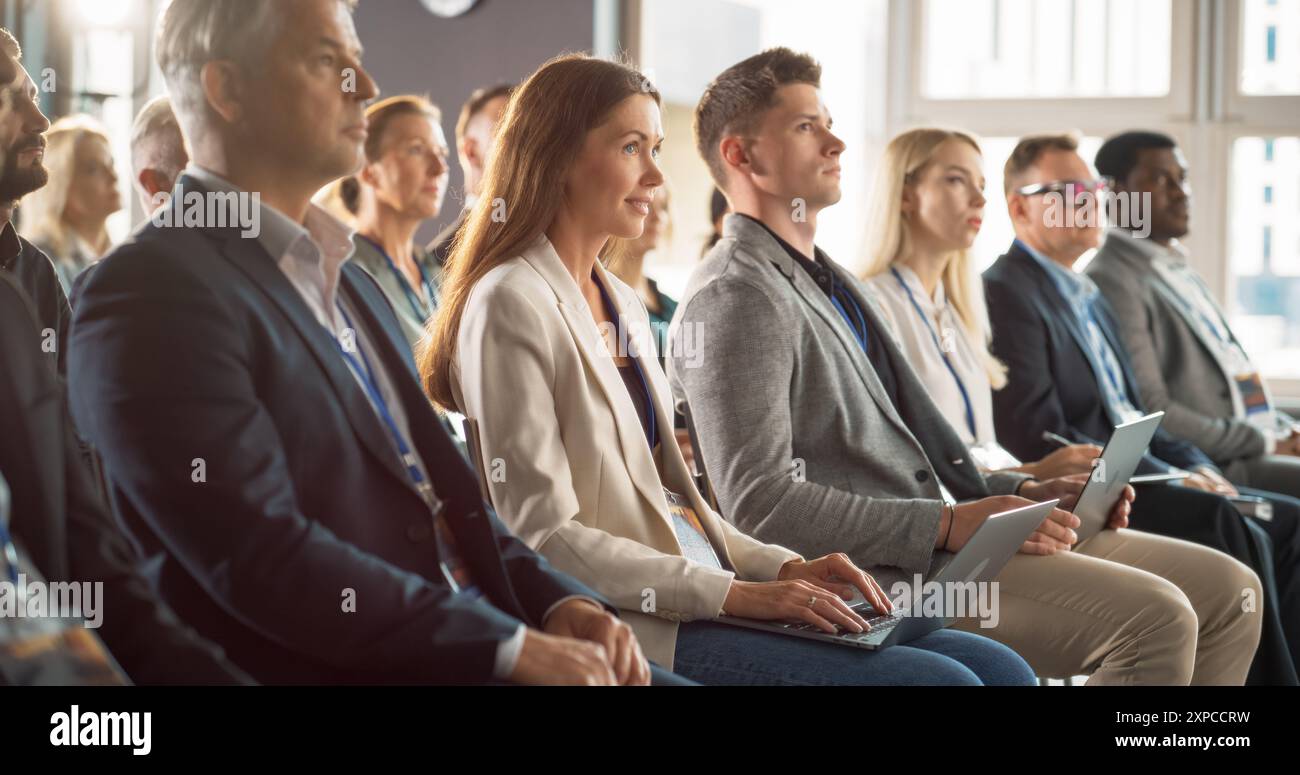 Young Woman Sitting in a Crowded Audience at a Business Conference ...