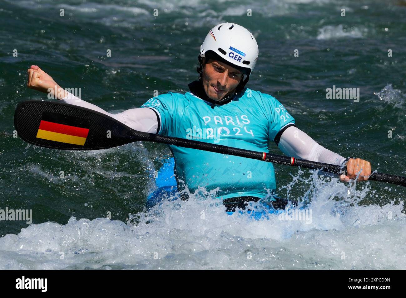 Noah Hegge of Germany reacts in the finish area of the men's kayak ...