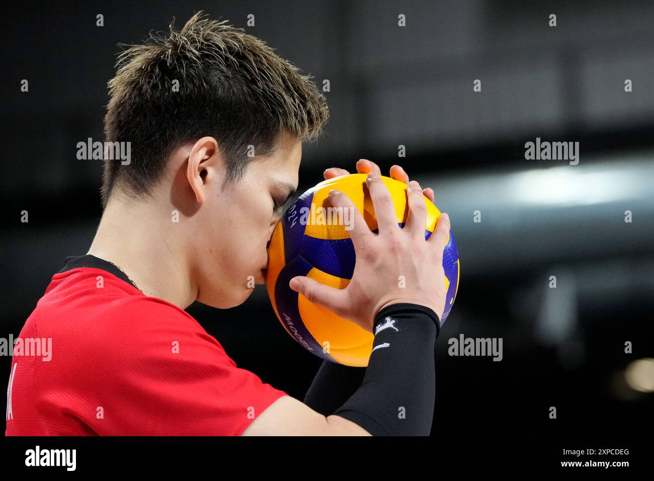Yuji Nishida, of Japan, kiss the ball during a men's quarter final ...