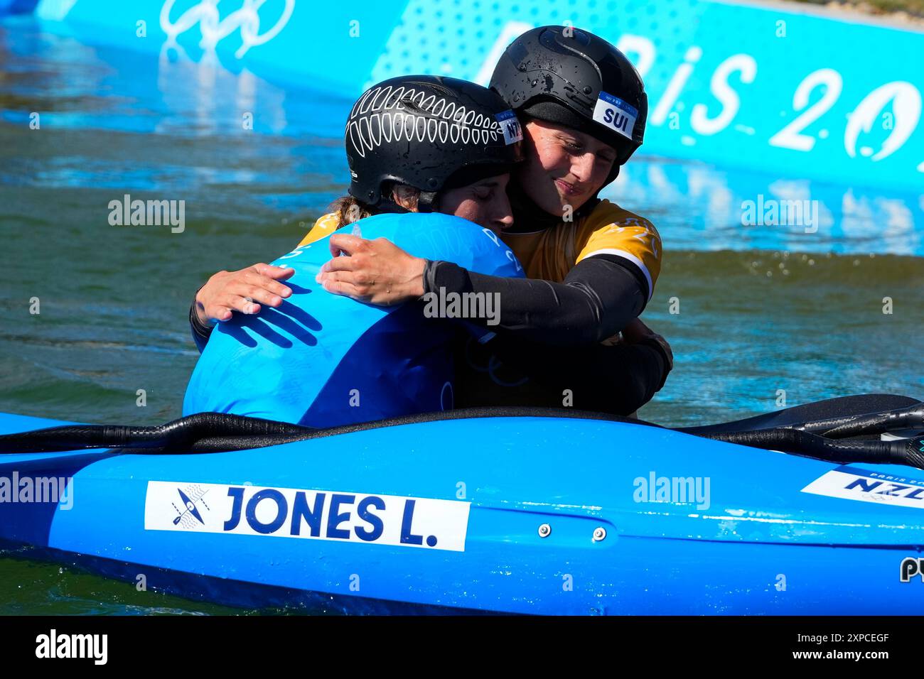 Luuka Jones of New Zealand embraces Alena Marx of Switzerland at the ...