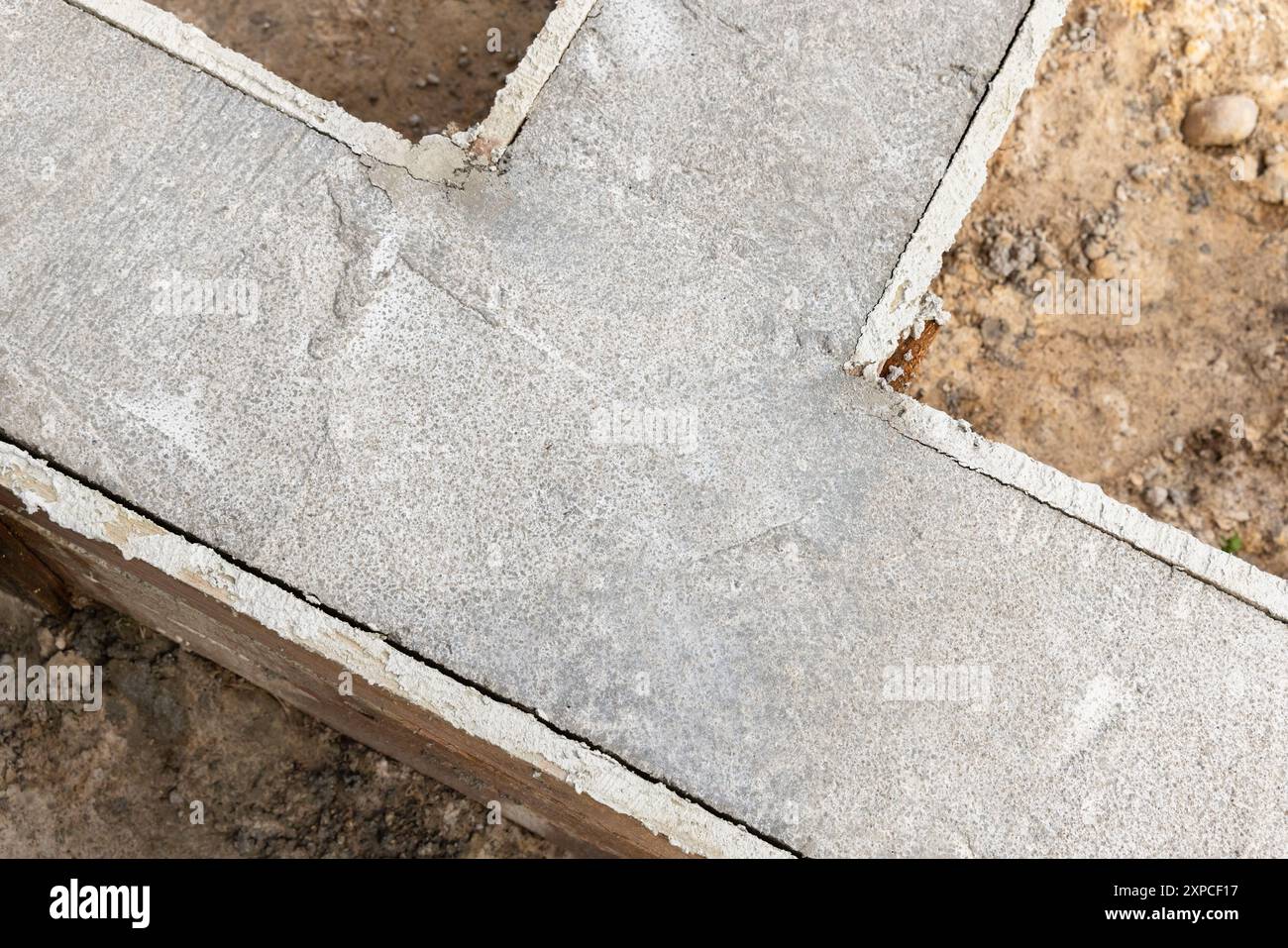Freshly laid concrete, top view. Foundation in wooden formwork. Rural ...