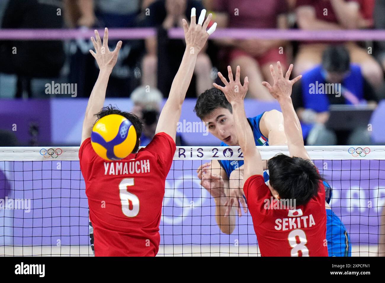 Simone Giannelli, of Italy, spikes a ball during a men's quarter final ...