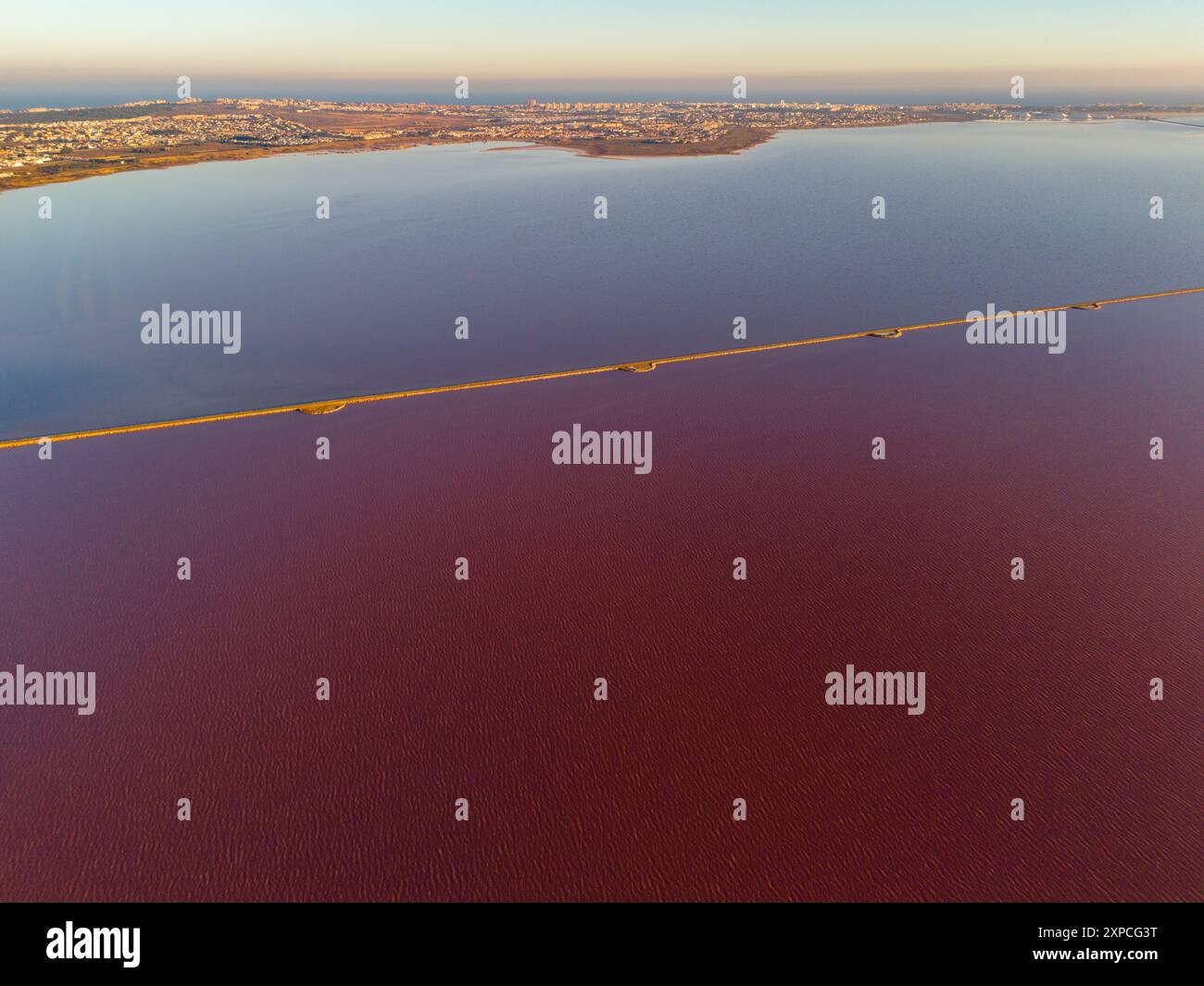 Pink salt lake, Las Salinas de Torrevieja is a lake that has a red or ...