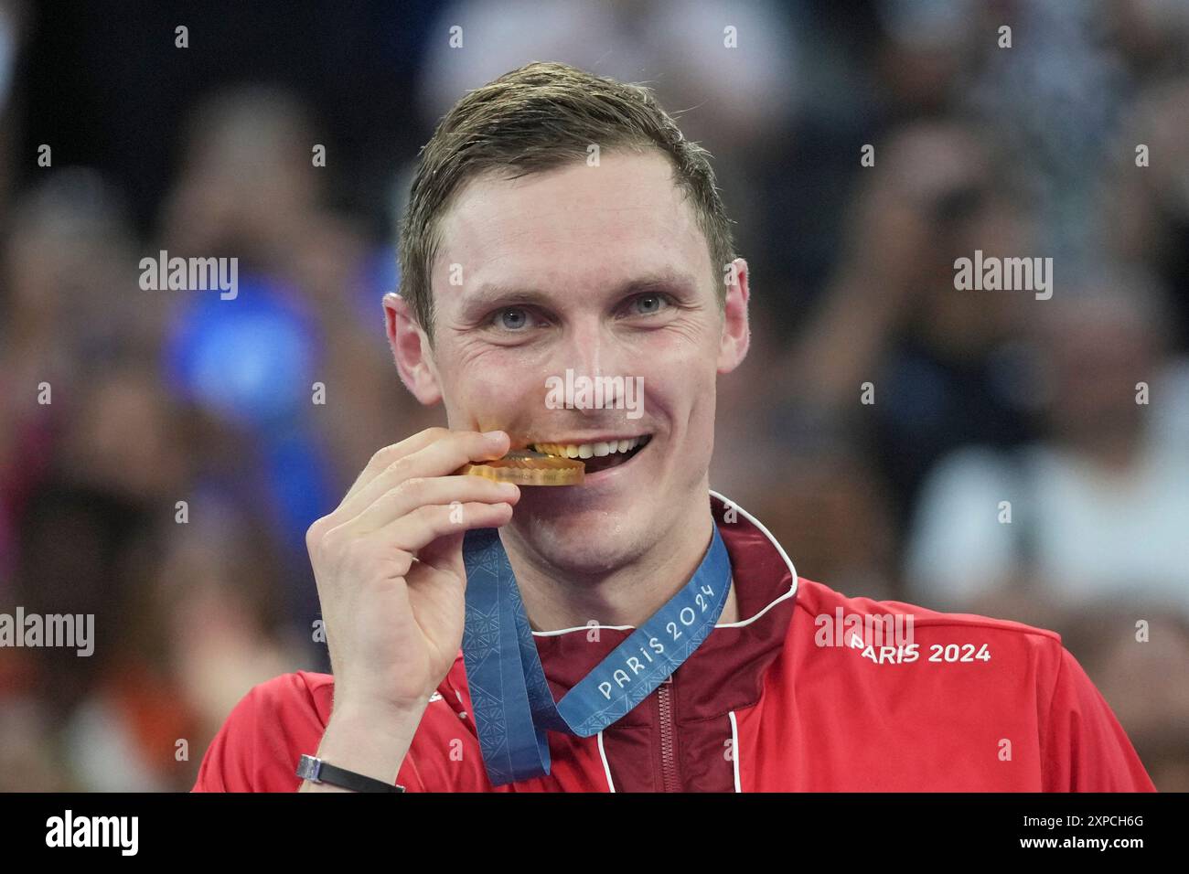Denmark's Viktor Axelsen celebrates after winning the gold medal at the ...