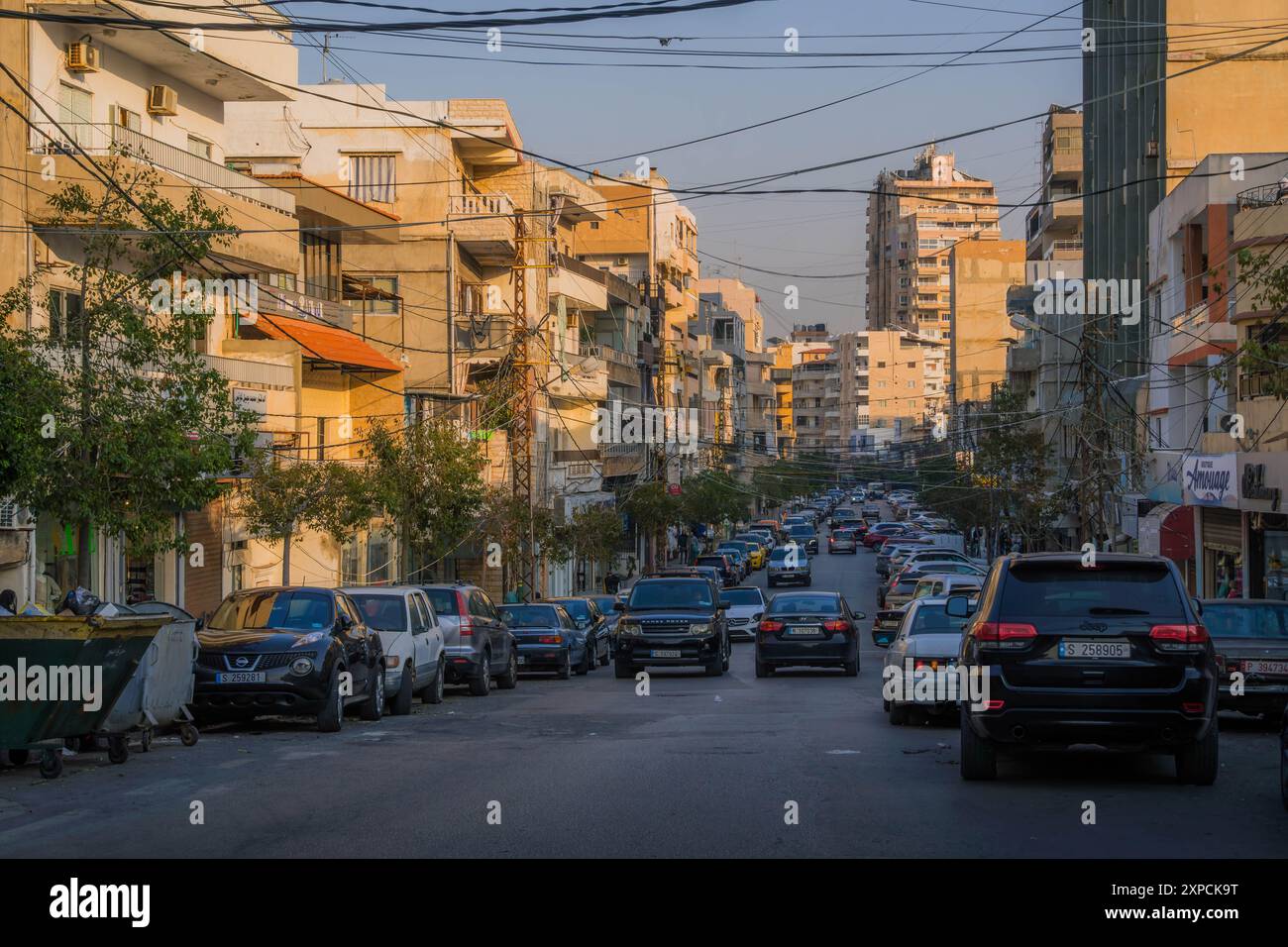 The streets with the cars and Lebanese buildings at Tyre (Tyr or Sour) in Lebanon, Middle East ...