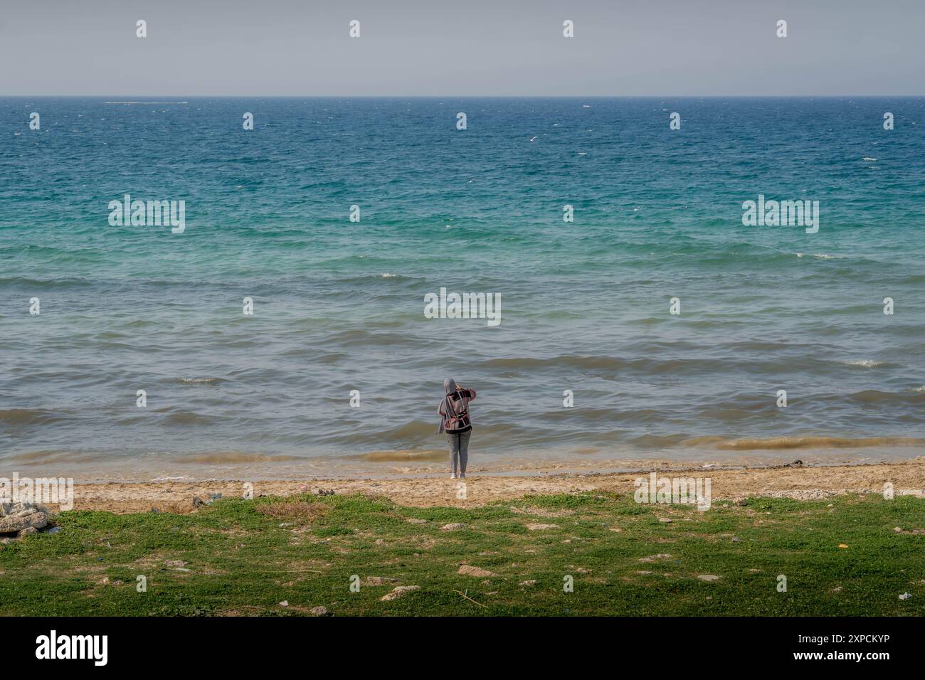 The Arab woman on the scenic sea shore of the Mediterranean on the ...