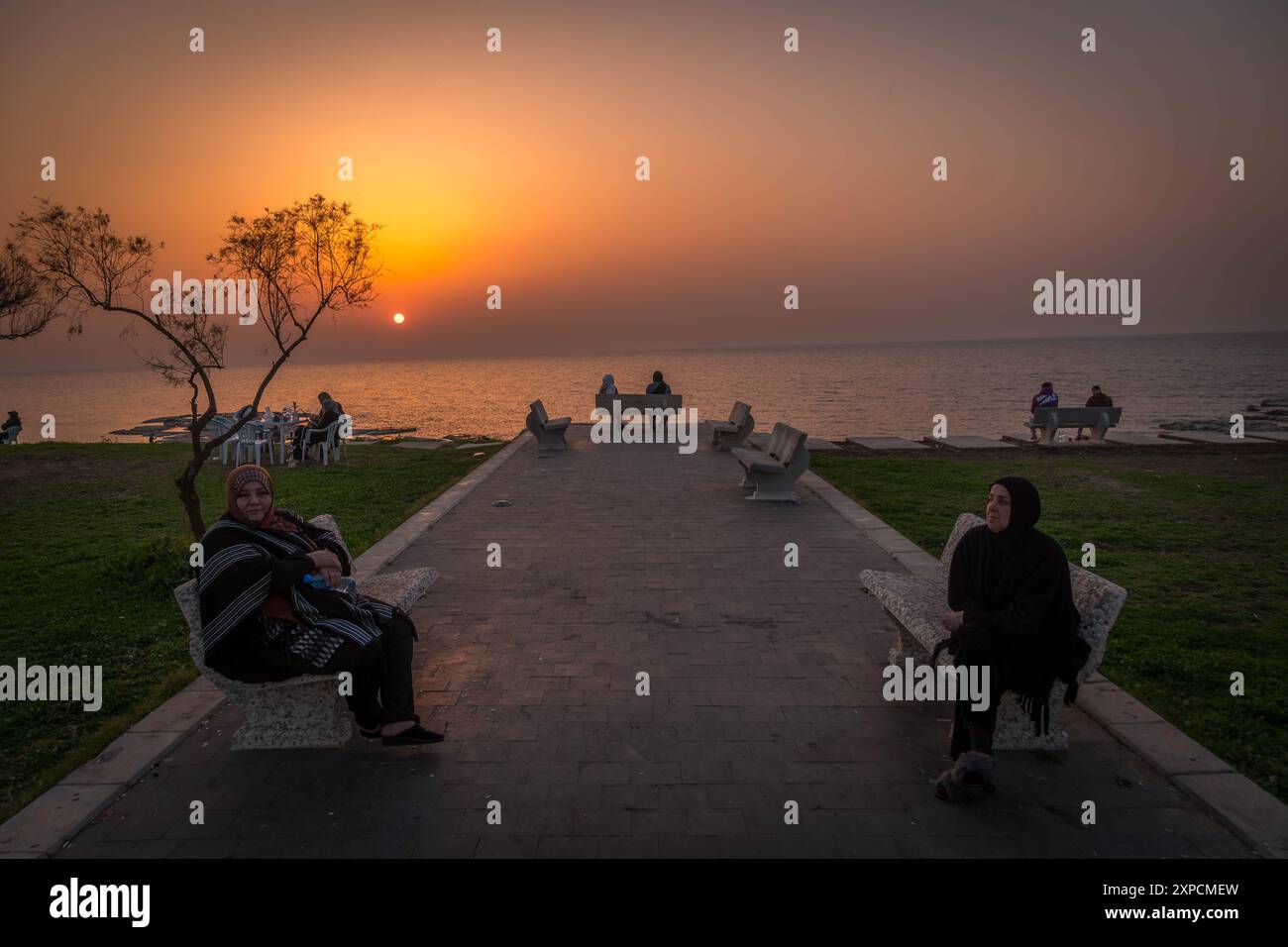 Lebanese Arab women sitting on the scenic Mediterranean coast ...