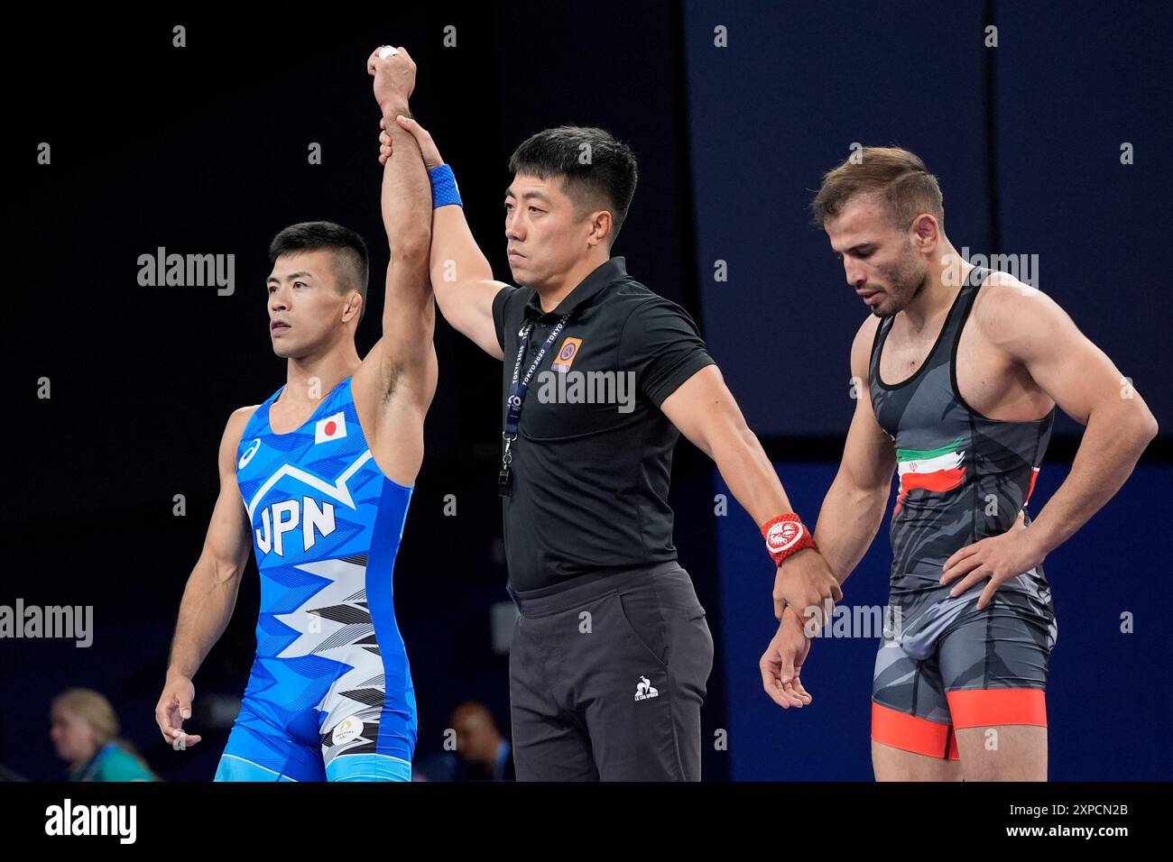 Japan's Kenichiro Fumita celebrates after defeating Iran's Mehdi ...