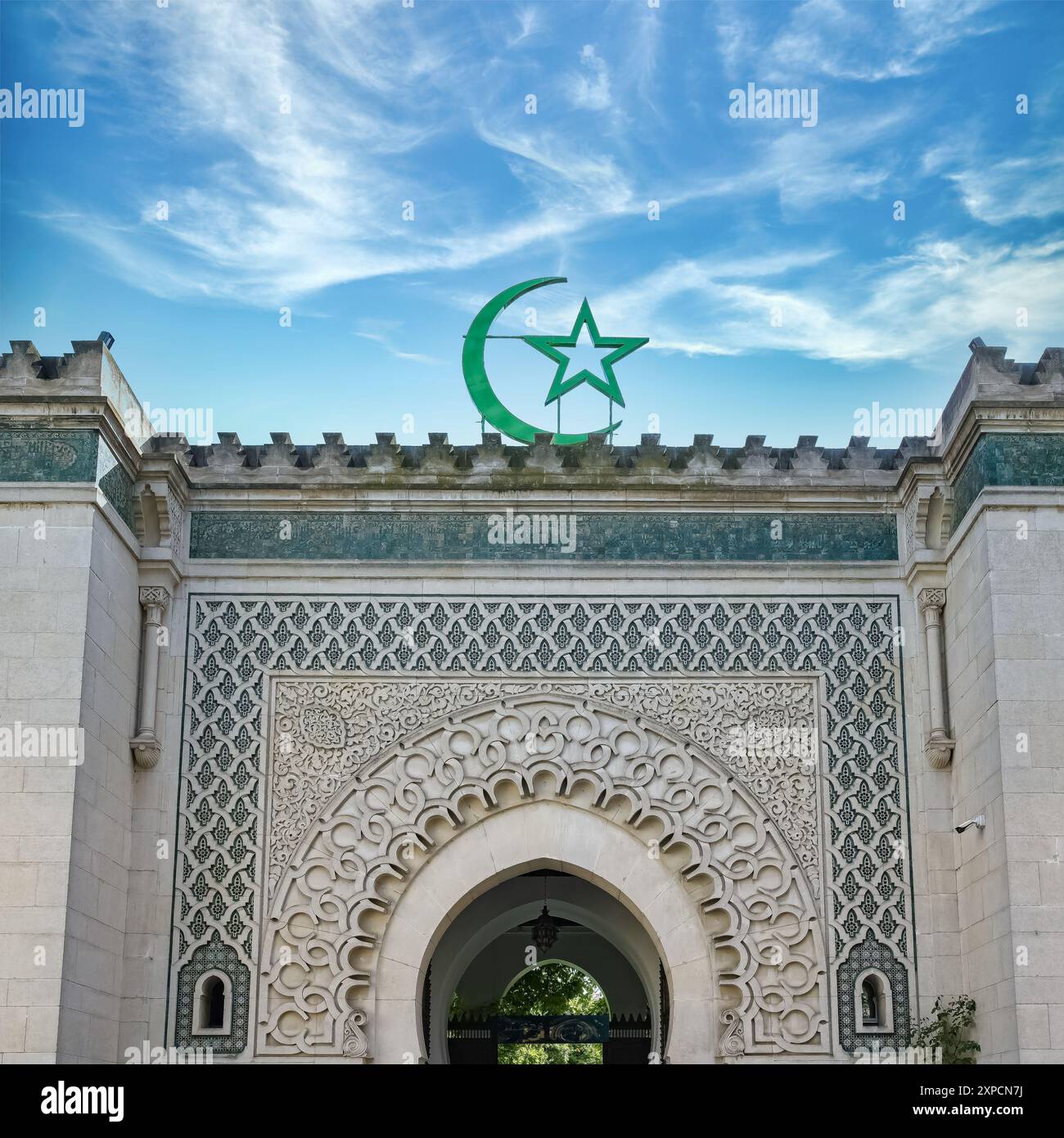 Intricate facade of the Grand Mosque of Paris with a clear sky ...