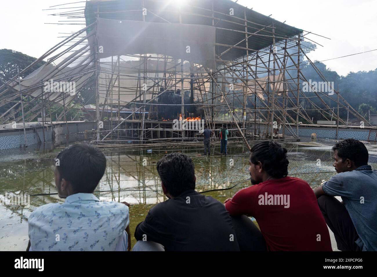 People watch an ongoing sculpture project of Sheikh Mujibur Rahman ...