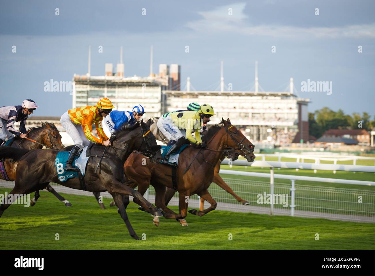Jockeys gallop from the starting gate at York including Robert Havlin ...