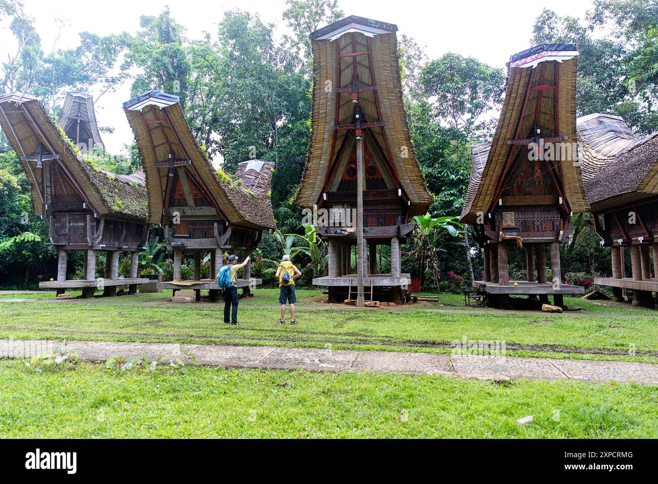 Mother and son, tourists exploring rice granaries at Buntu Pune ...