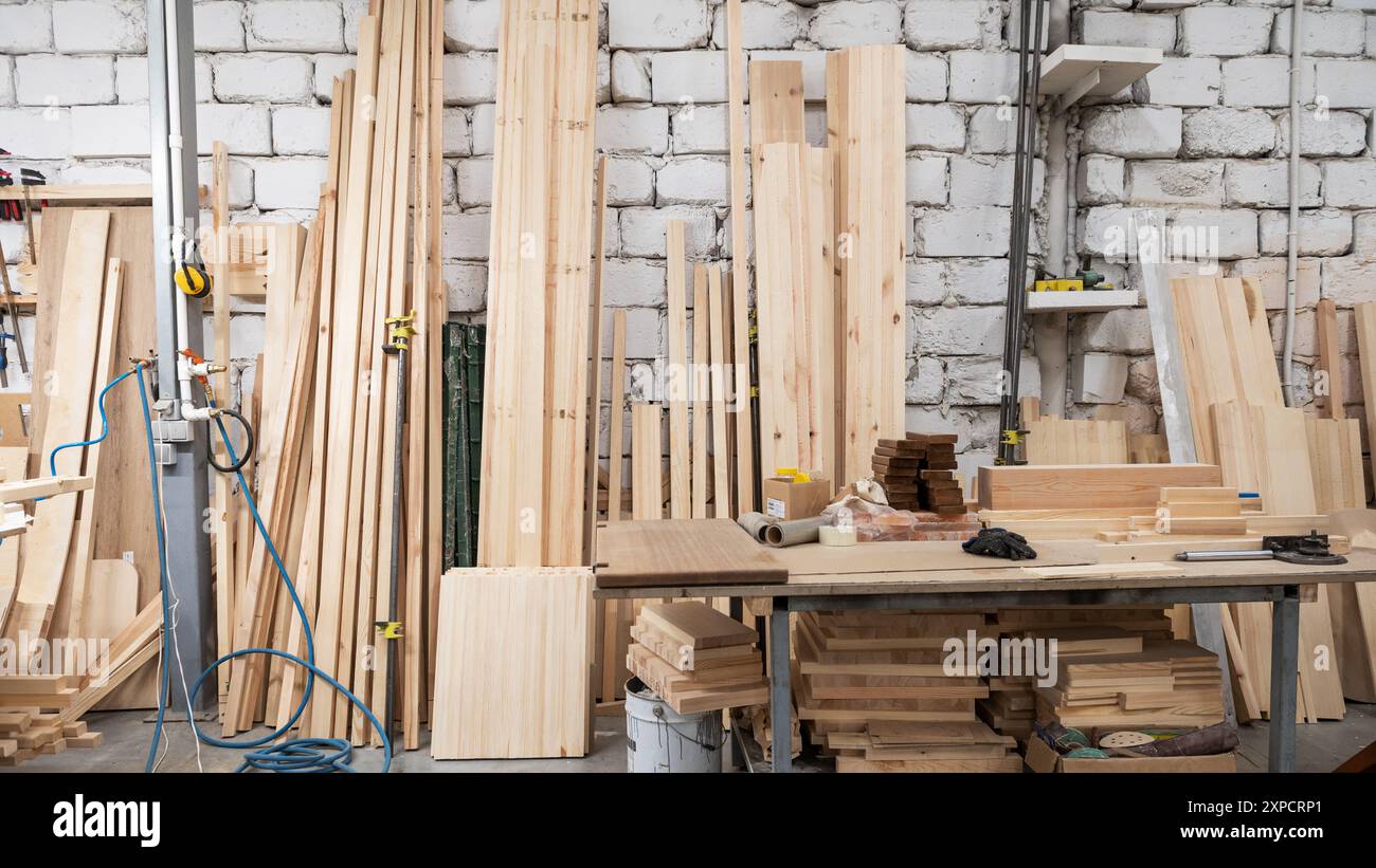 Furniture factory workshop with different wood items Stock Photo - Alamy