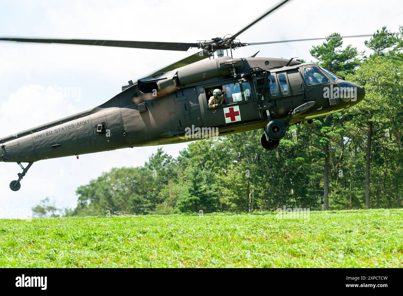 Medical team on a Sikorsky HH-60M MEDEVAC Black Hawk Helicopter landing ...