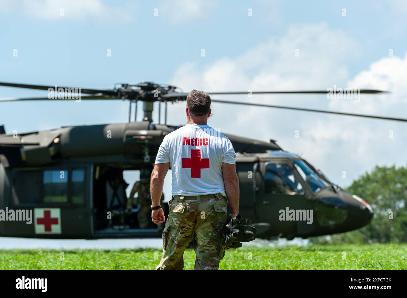 United States Army Medical team attending to an injured paratrooper at ...