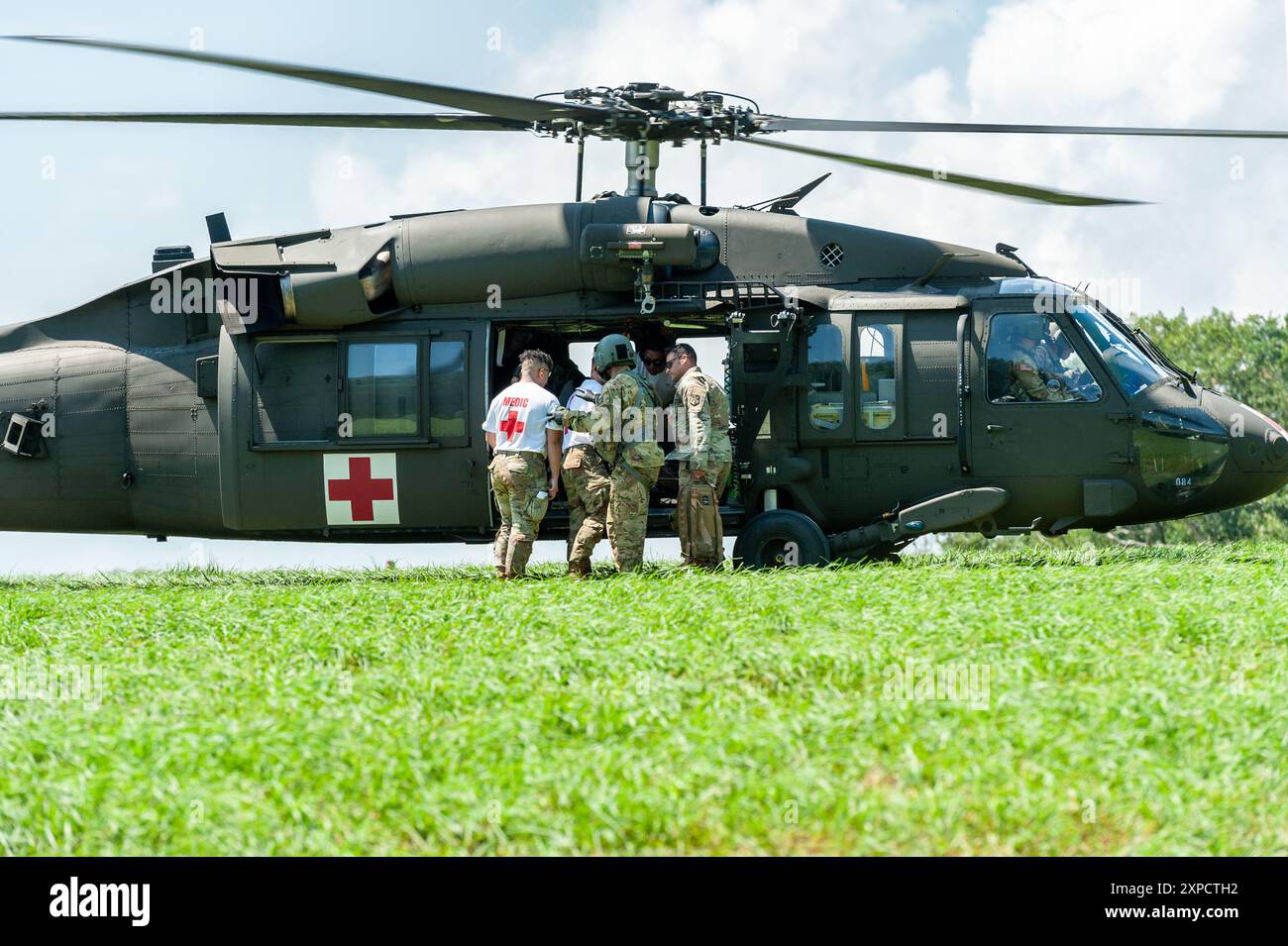 United States Army Medical team attending to an injured paratrooper at ...