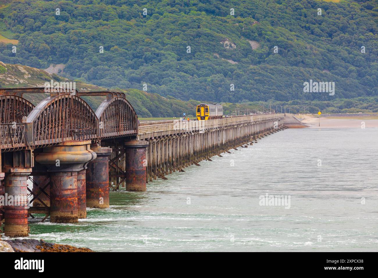 Diesel Multiple Unit (DMU) crossing Barmouth Bridge, over the Mawddach ...