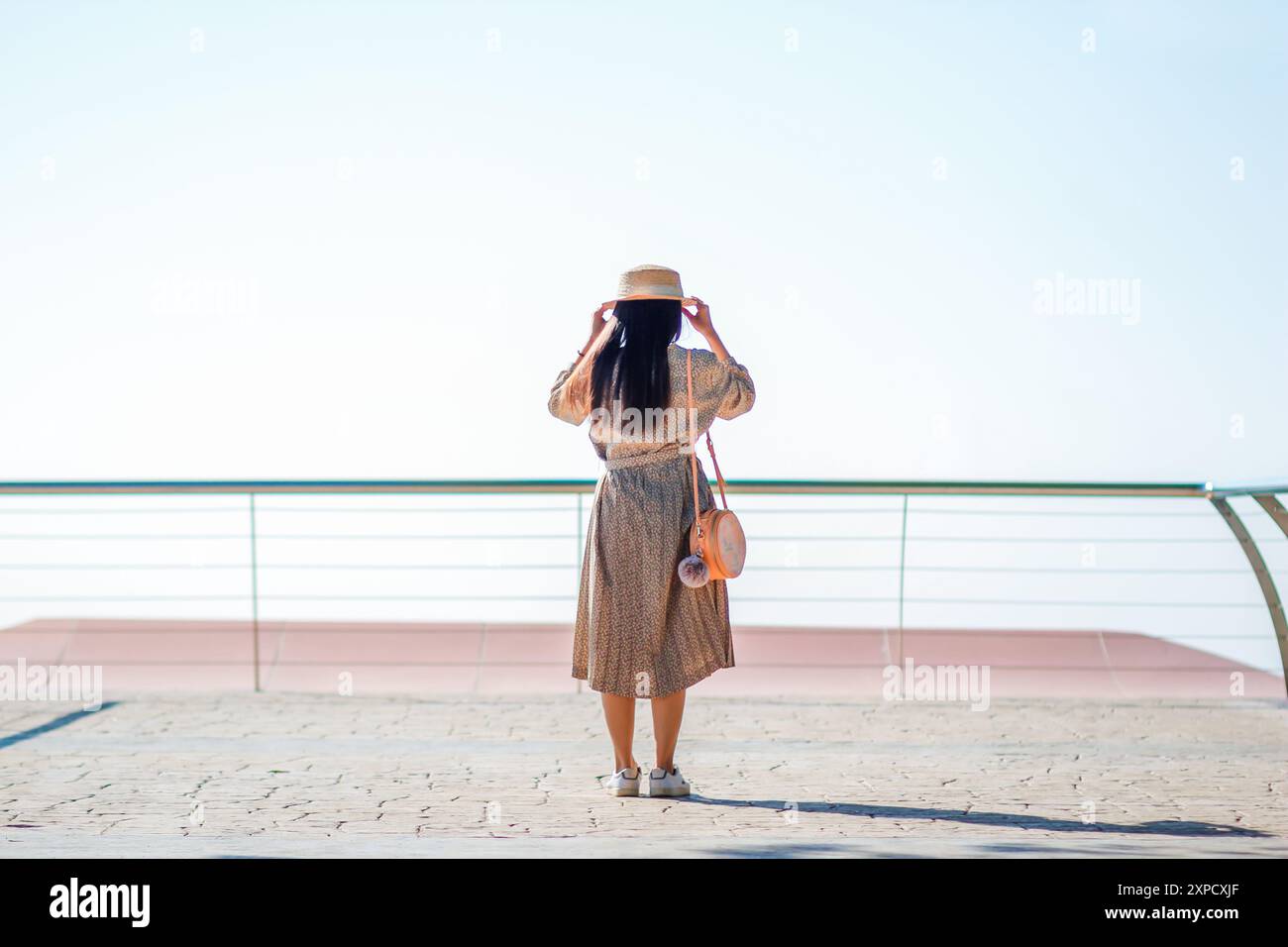Smooth Focus, A young Asian female tourist is happily walking around ...
