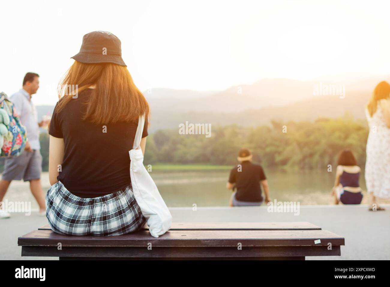 Blurred image,A young woman who feels lonely and sad alone on the edge ...
