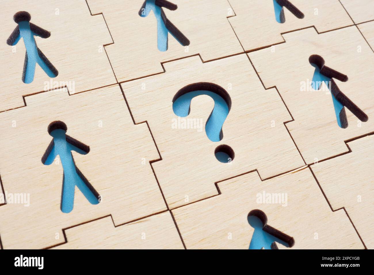 A puzzle with employee figures and a question mark as a concept for ...
