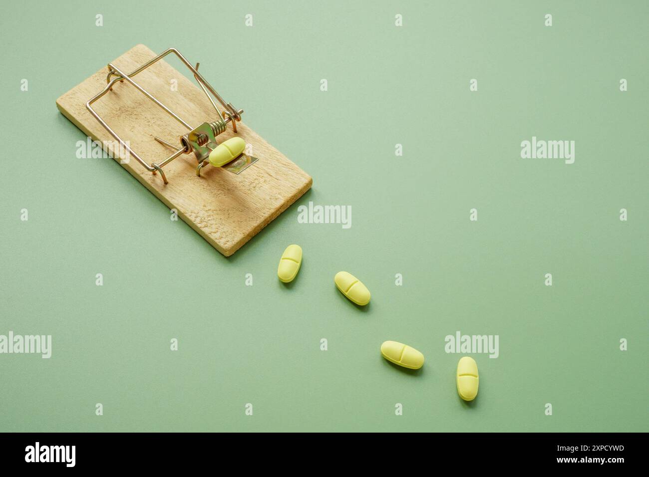 The trap and the pills as a symbol of drug addiction and side effects ...