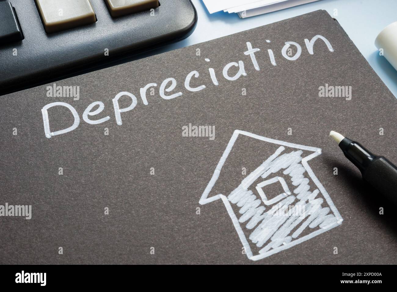 House depreciation concept. Dark notepad with marker Stock Photo - Alamy