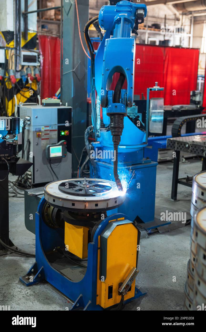 Automatic Industrial welding robot in a modern factory in operation ...