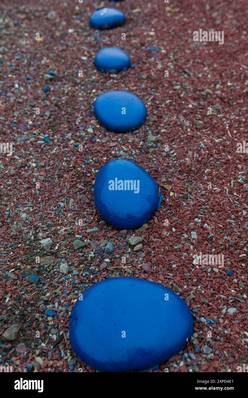 Blue painted stones surrounding grave, local village cemetary ...