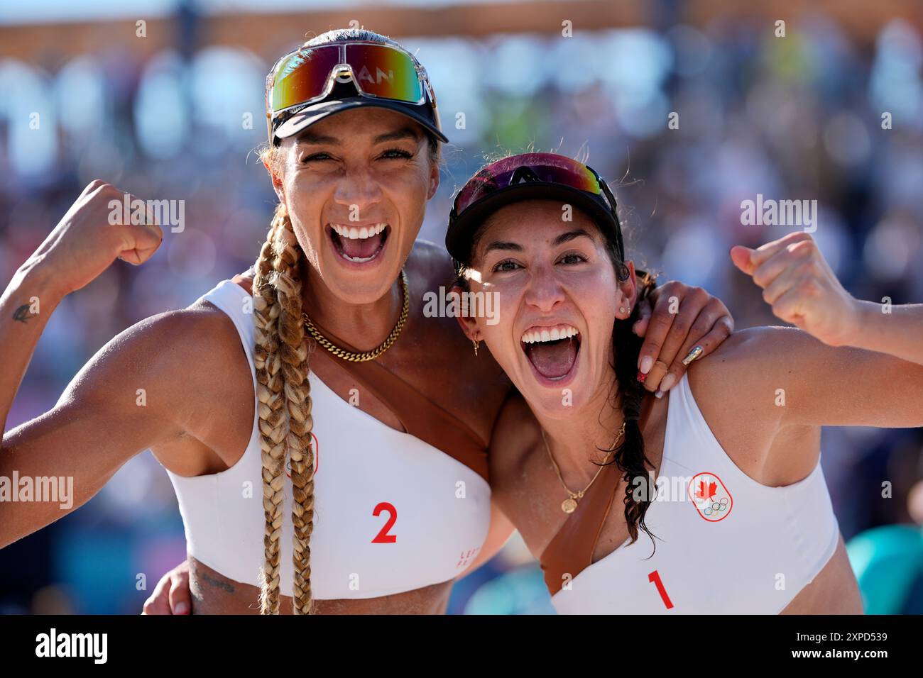 Canada's Brandie Wilkerson, left, and Melissa Humana-Paredes give a ...