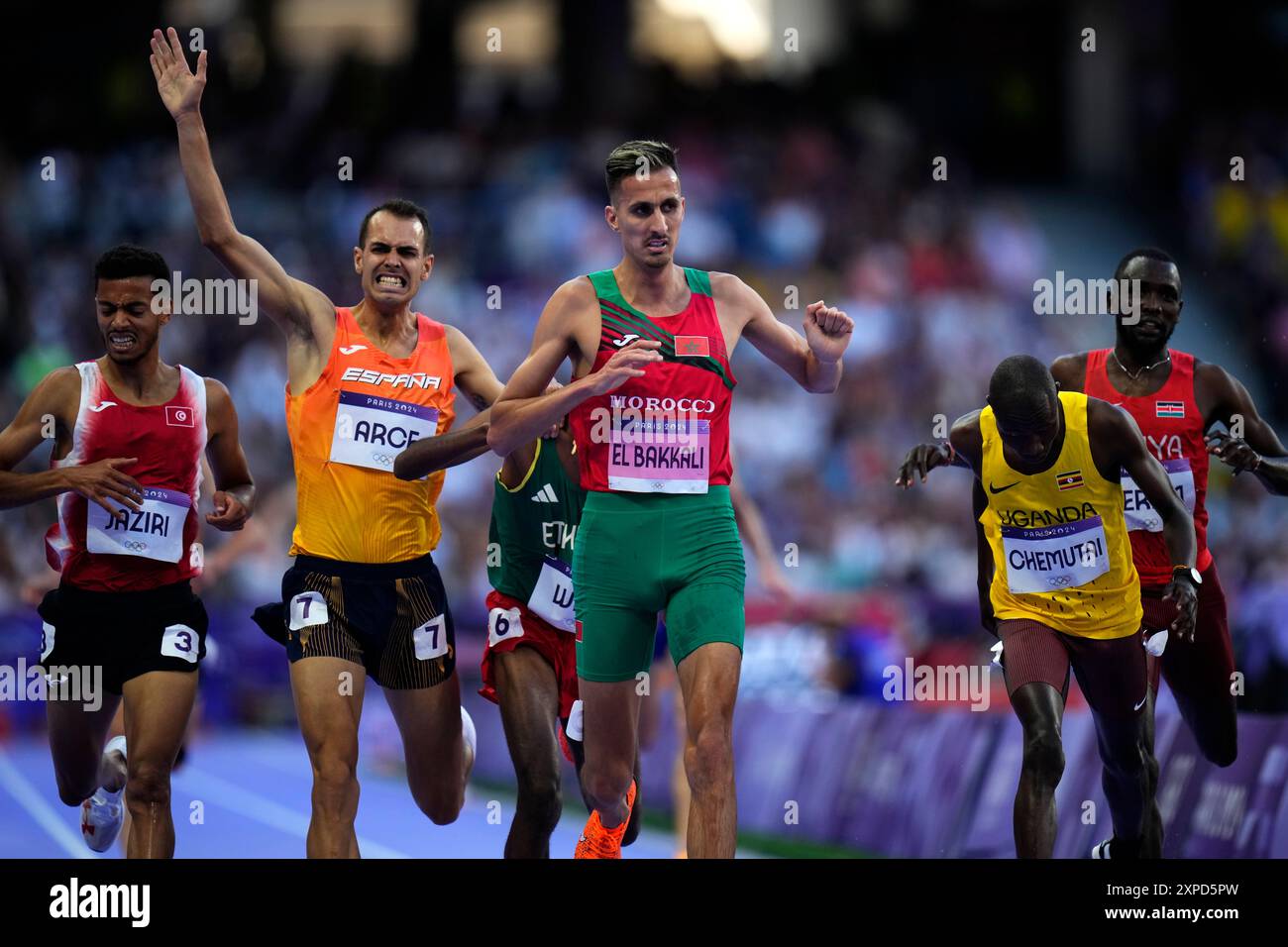 Soufiane El Bakkali, of Morocco, leads the field across the line in ...