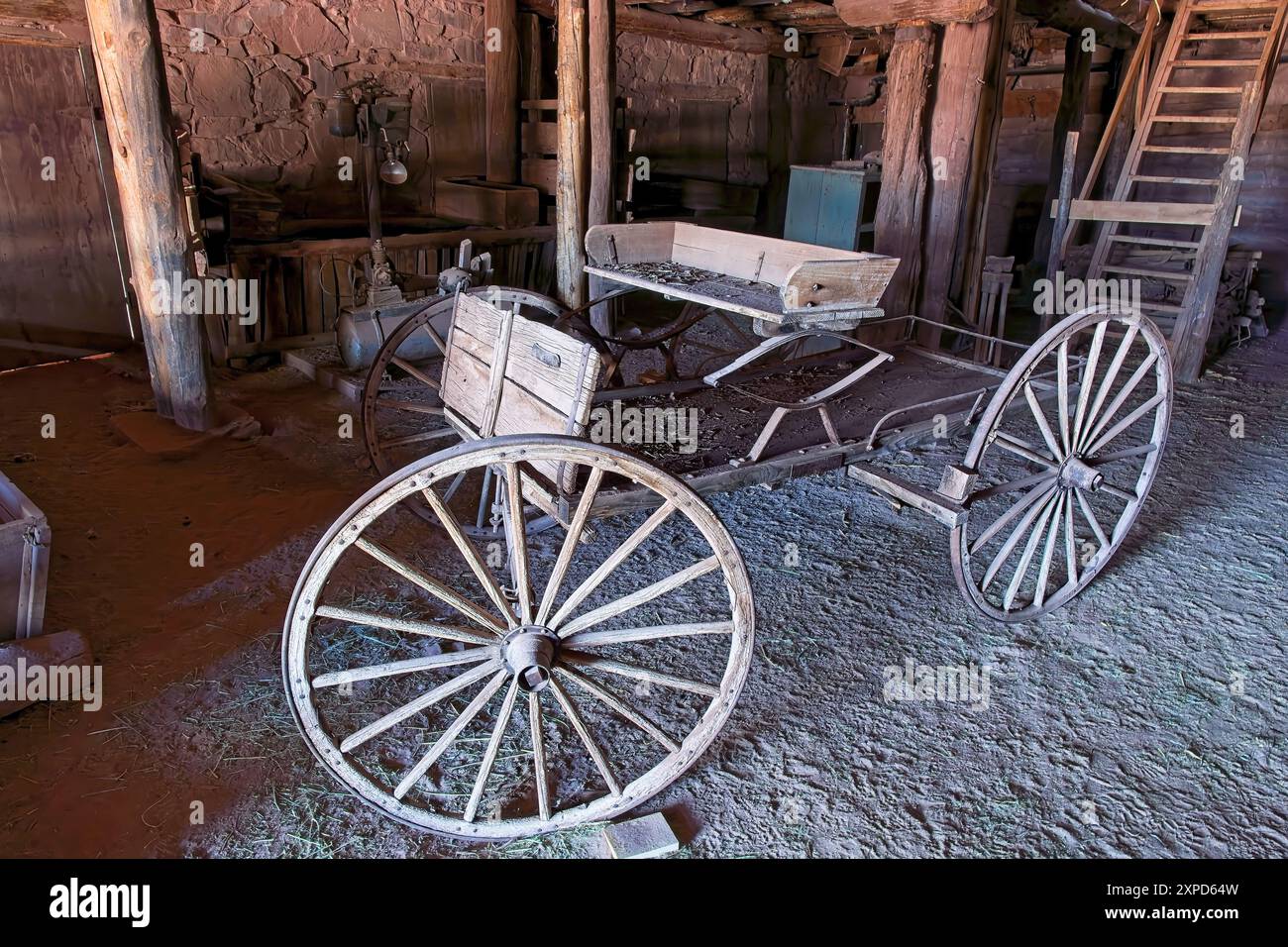 Horse drawn buckboard wagon in rustic barn Stock Photo - Alamy