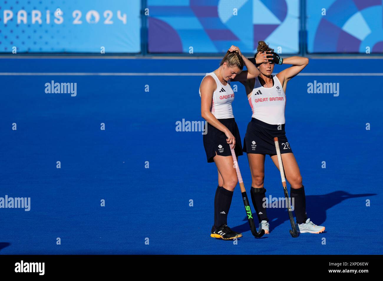 Britain's Lily Owsley, left, and Flora Peel react after their loss ...