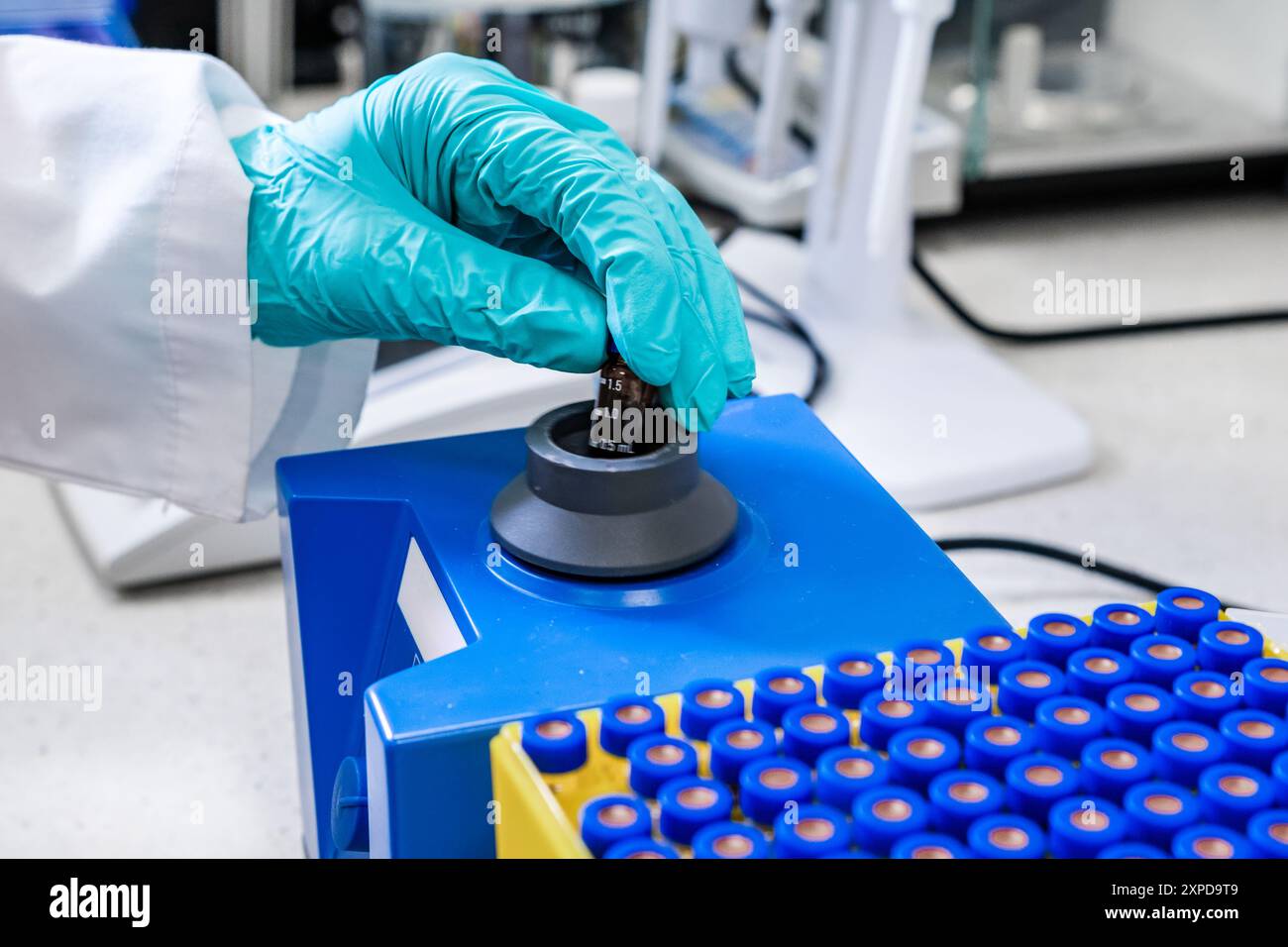 Samples are shaken by a chemist with a vortex mixer before HPLC ...