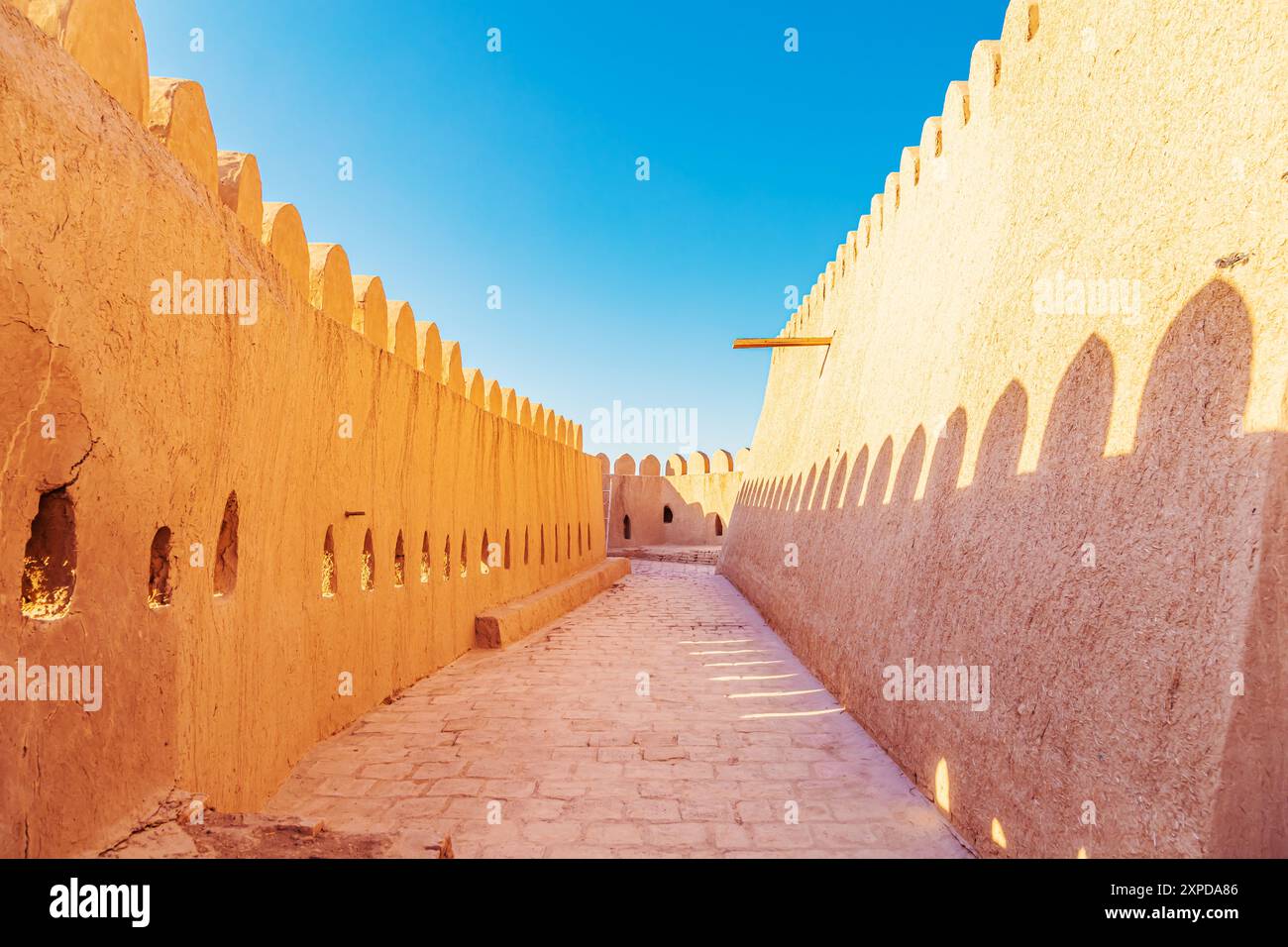 The city walls of the ancient city of Khiva at sunset. Khiva ...