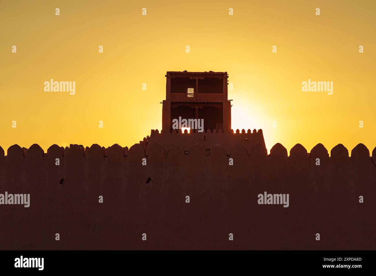 The city walls of the ancient city of Khiva at sunset. Khiva ...