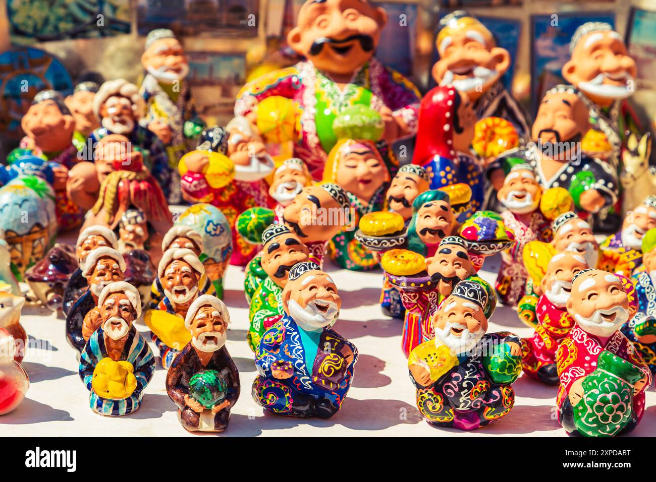 Funny ceramic figures of people at a street bazaar in Ichan Kala, Khiva ...