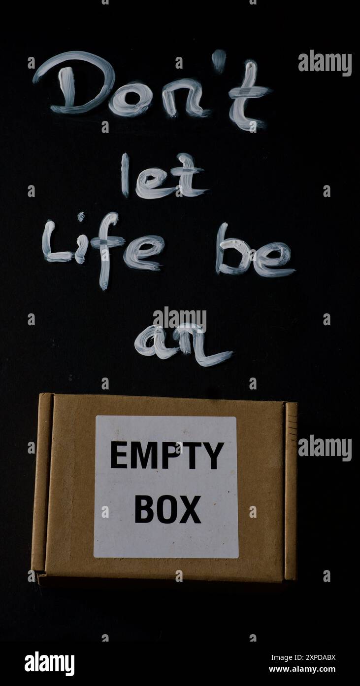 Don't let life be an empty box - handwritten in white letters on black ...